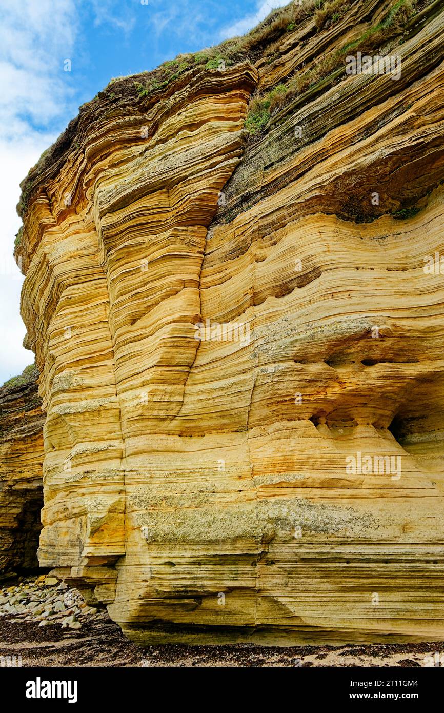 Hopeman Moray Coast Scotland blue sky over layers of golden coloured ...