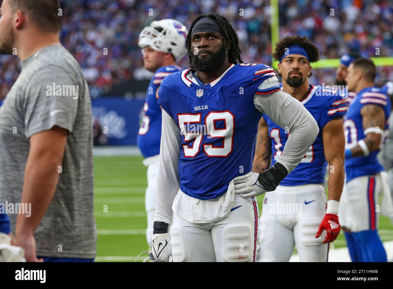 Buffalo Bills defensive end Kingsley Jonathan (59) walks the sideline ...