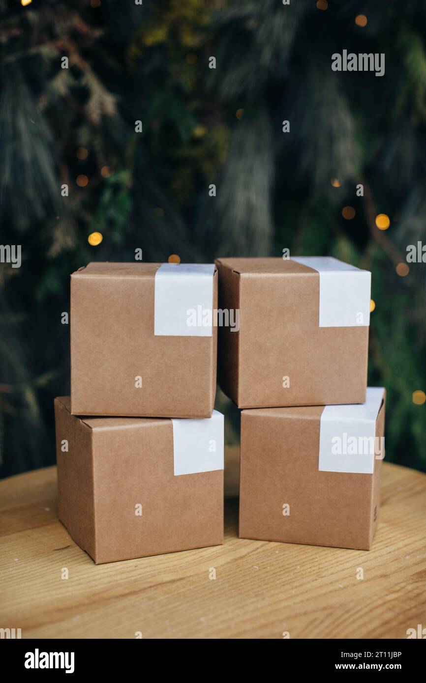 Mockup. Kraft paper boxes with white stickers on Christmas background ...