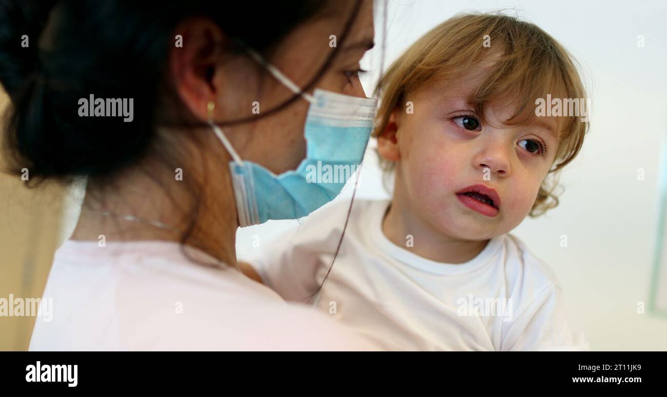 Mother baby mask crying hi-res stock photography and images - Alamy