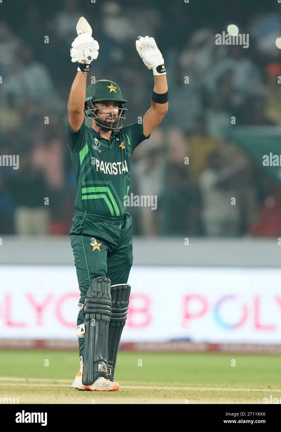 Pakistan's Abdullah Shafique raises his bat after scoring century ...