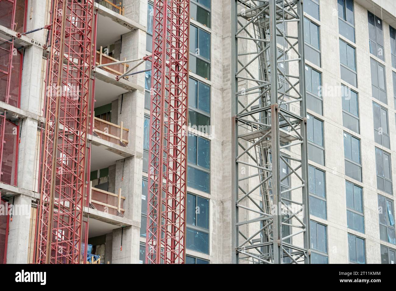 Photo of elevator lift and crane section attached to a building under ...