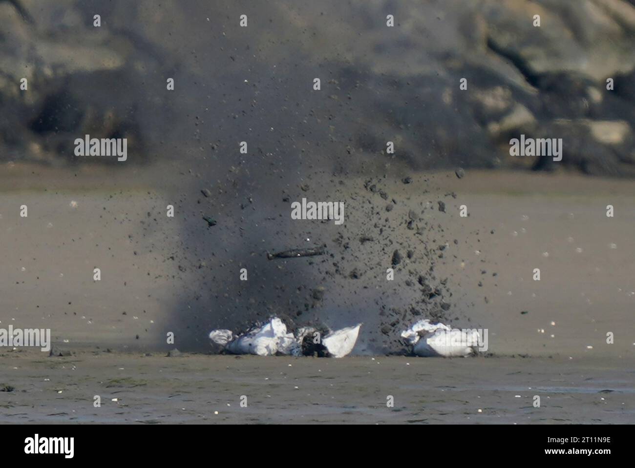 A controlled explosion is carried out on a suspect package, at ...