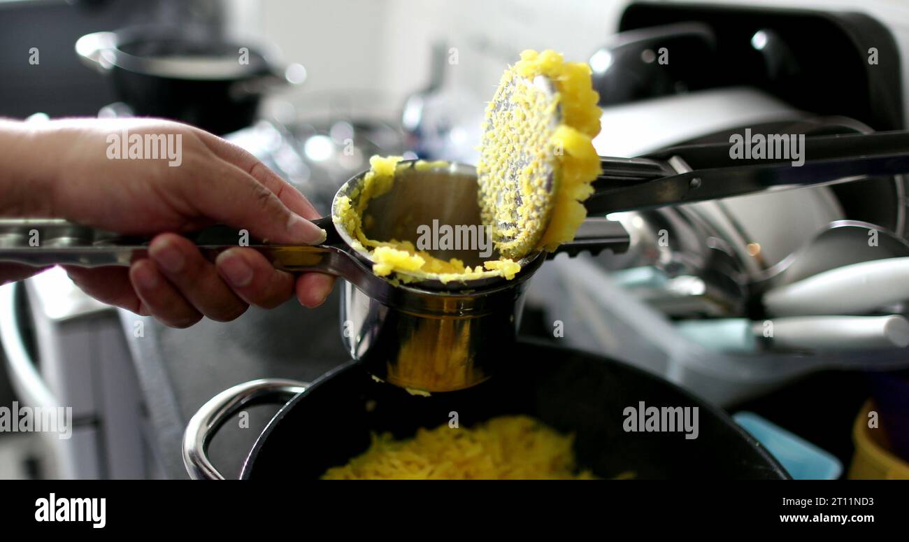 Close-up hands preparing mandioc food pressing ingredient Stock Photo ...