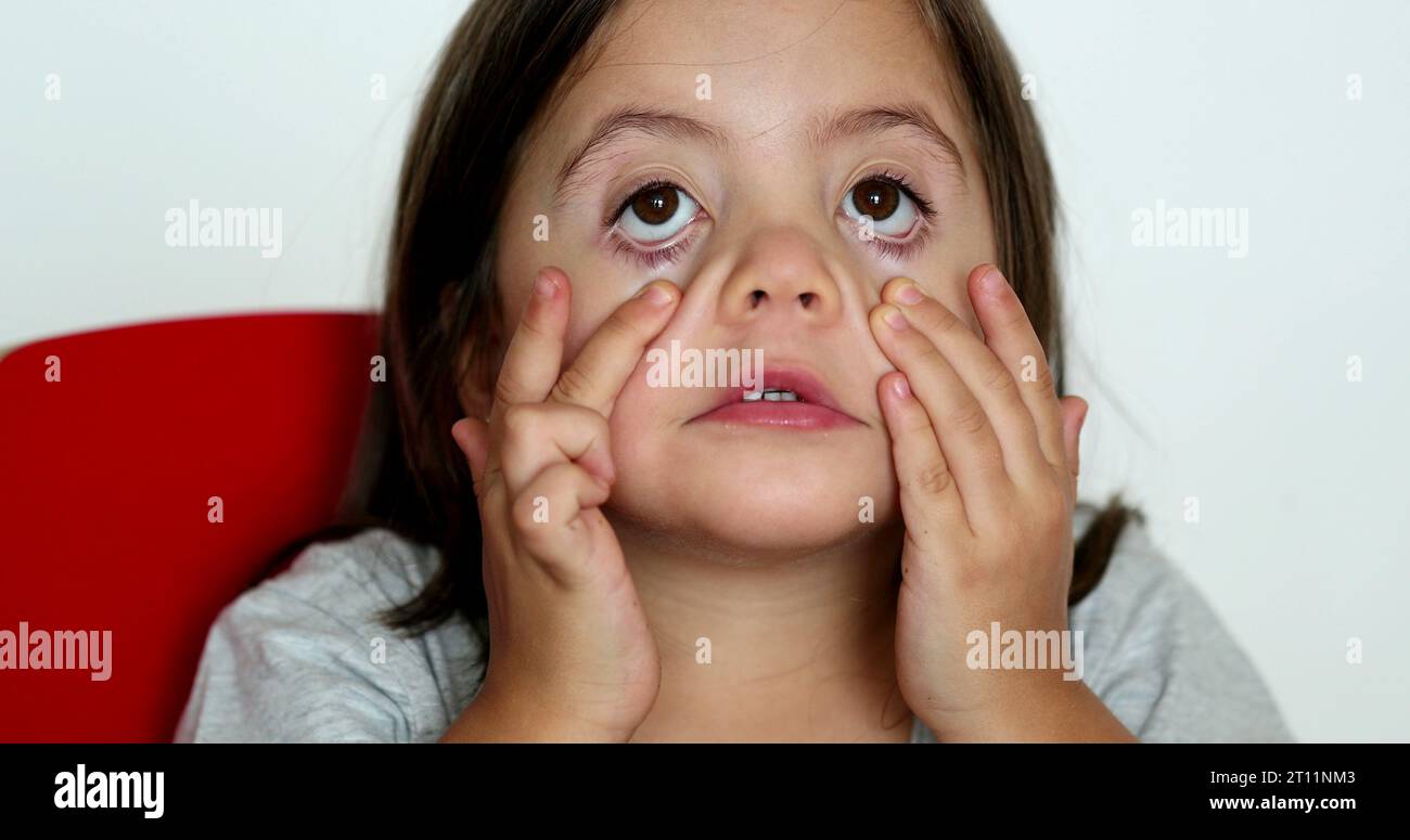 Little girl grimacing, sticking ongue out. Child grimace making funny ...