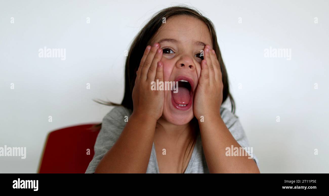 Cute little girl shock surprise reaction Stock Photo - Alamy