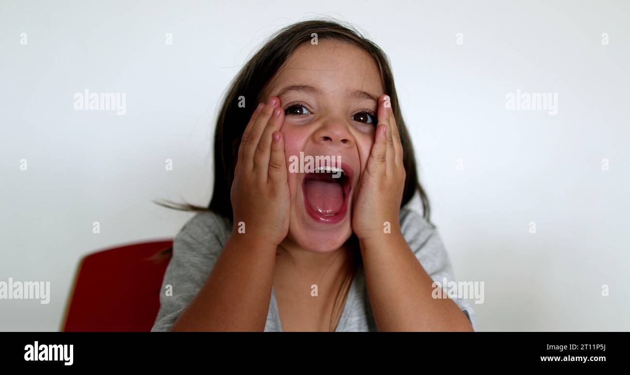 Cute little girl shock surprise reaction Stock Photo - Alamy