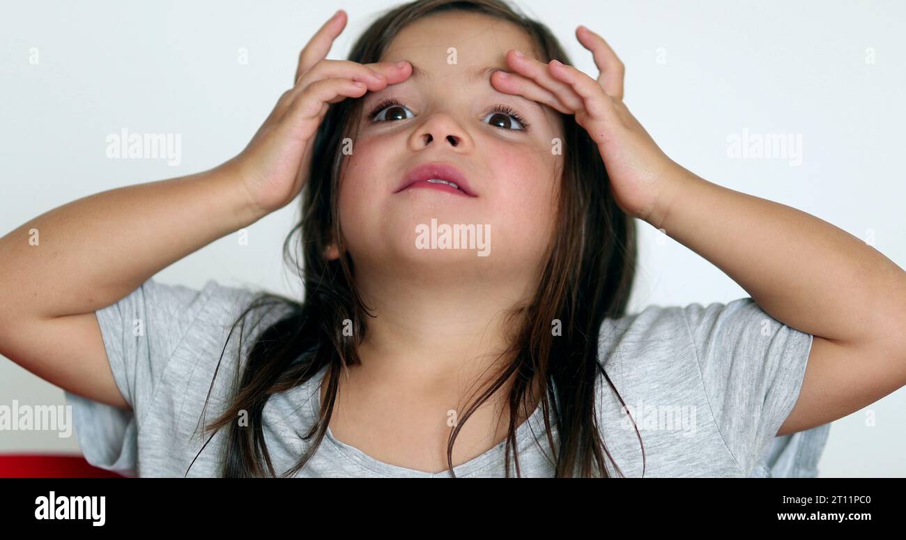 Little girl grimacing, sticking ongue out. Child grimace making funny ...