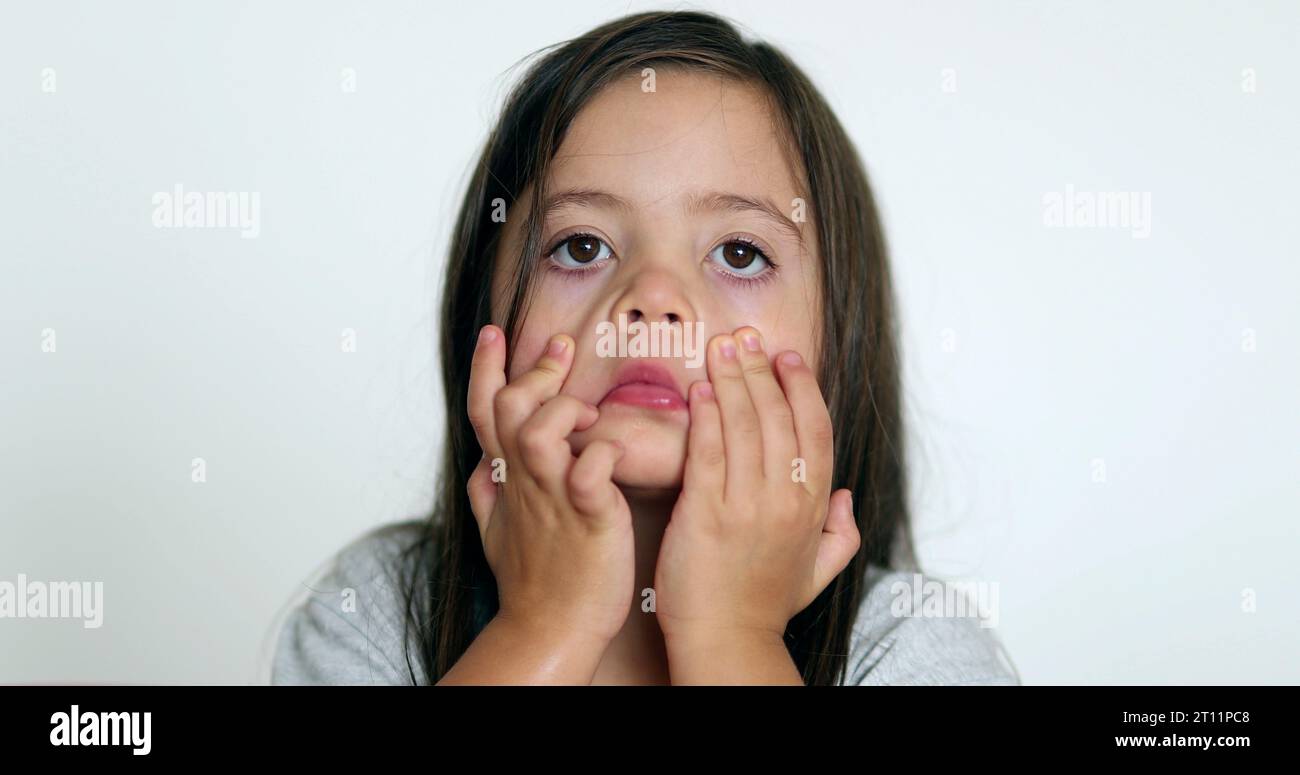 Little girl grimacing, sticking ongue out. Child grimace making funny ...