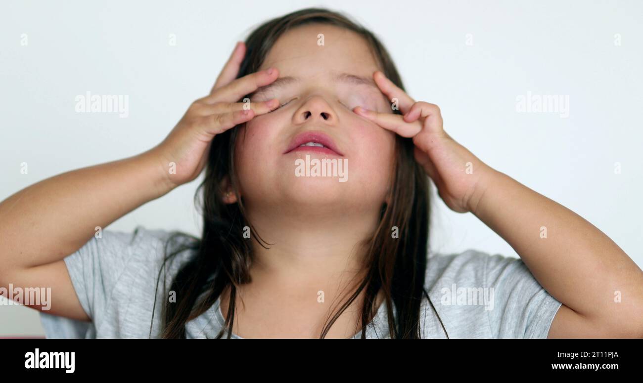 Little girl grimacing, sticking ongue out. Child grimace making funny ...