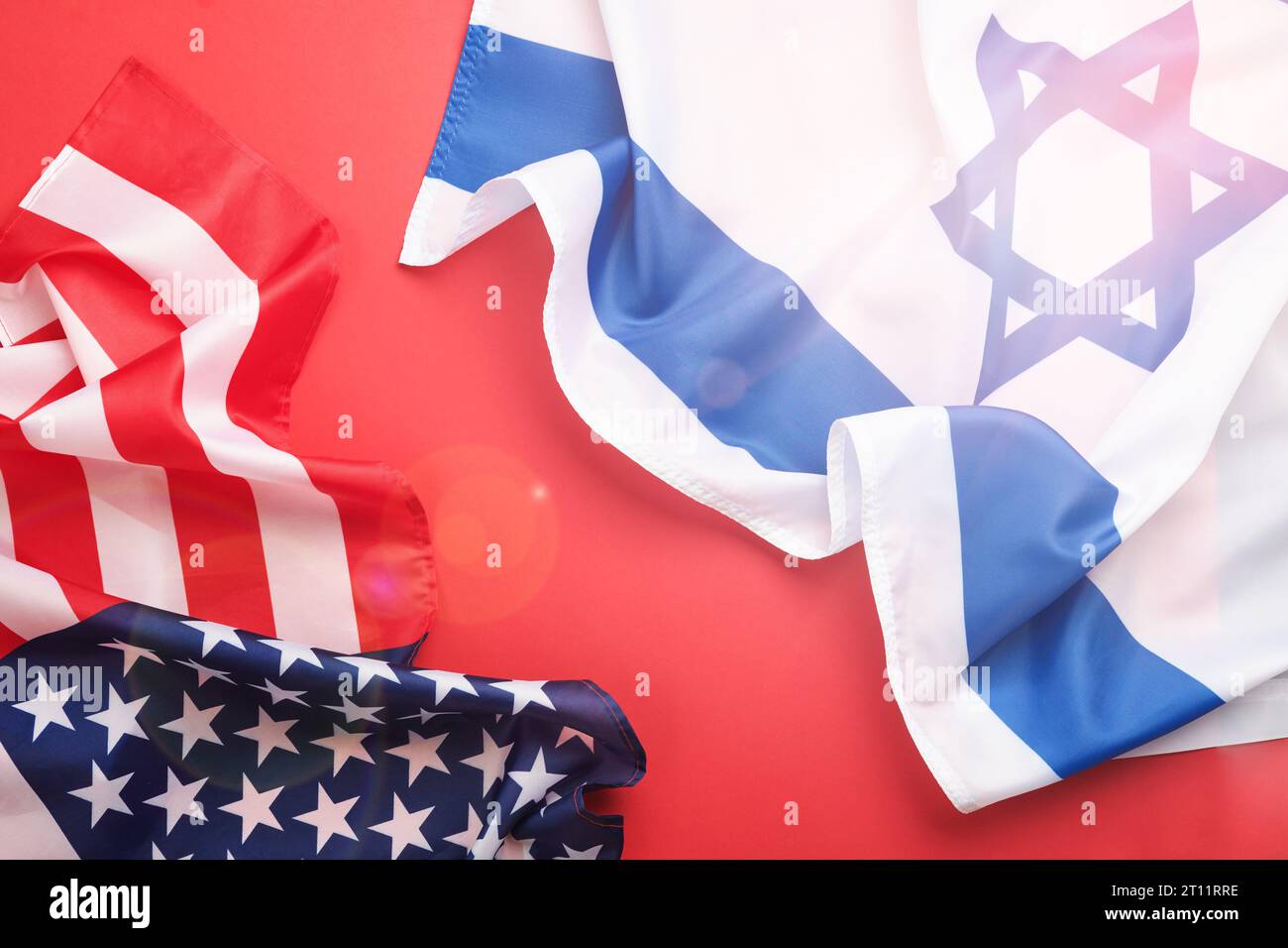 USA Israel flags. Two American and Israeli flags lie on red texture ...