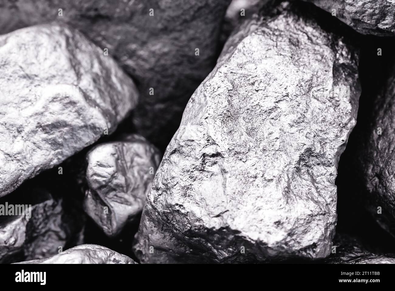 Raw manganese. Manganese stone isolated on black background. Mineral ...