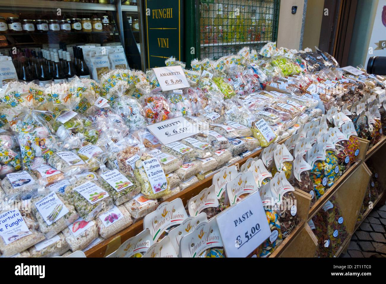 Display of various packaged Italian pasta and risotto at a market stall ...