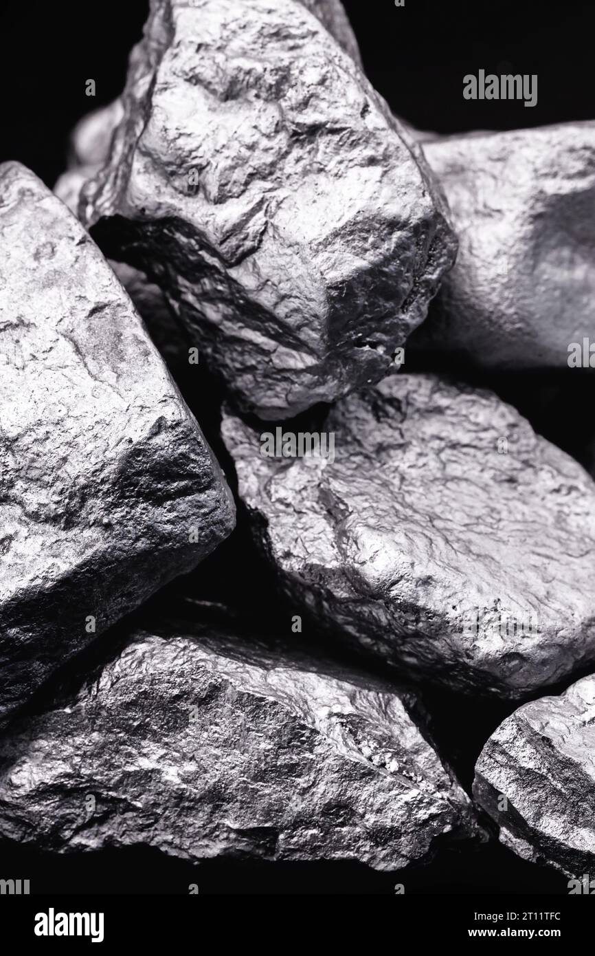 Raw manganese. Manganese stone isolated on black background. Mineral ...