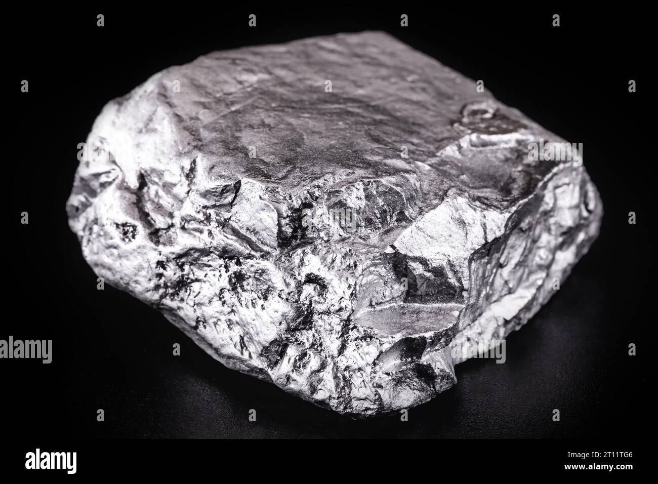 small titanium stone, metal used in light alloys. Macro photography of ...