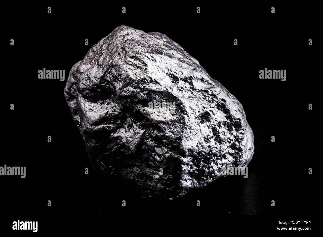 large silver stone, rare silver nugget on black background. Gemstone in ...