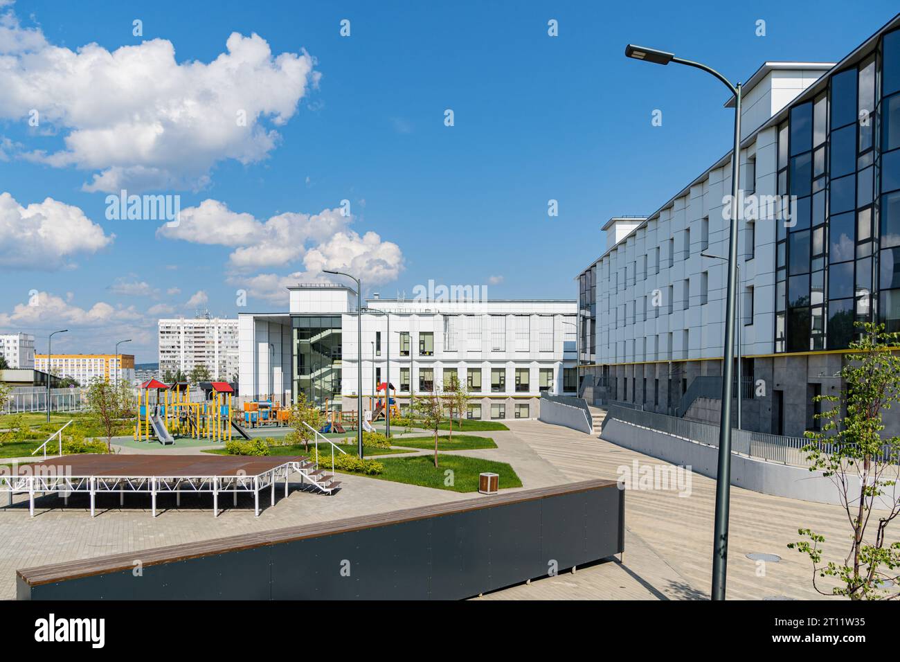 New building facade in housing complex. Modern style in architecture ...