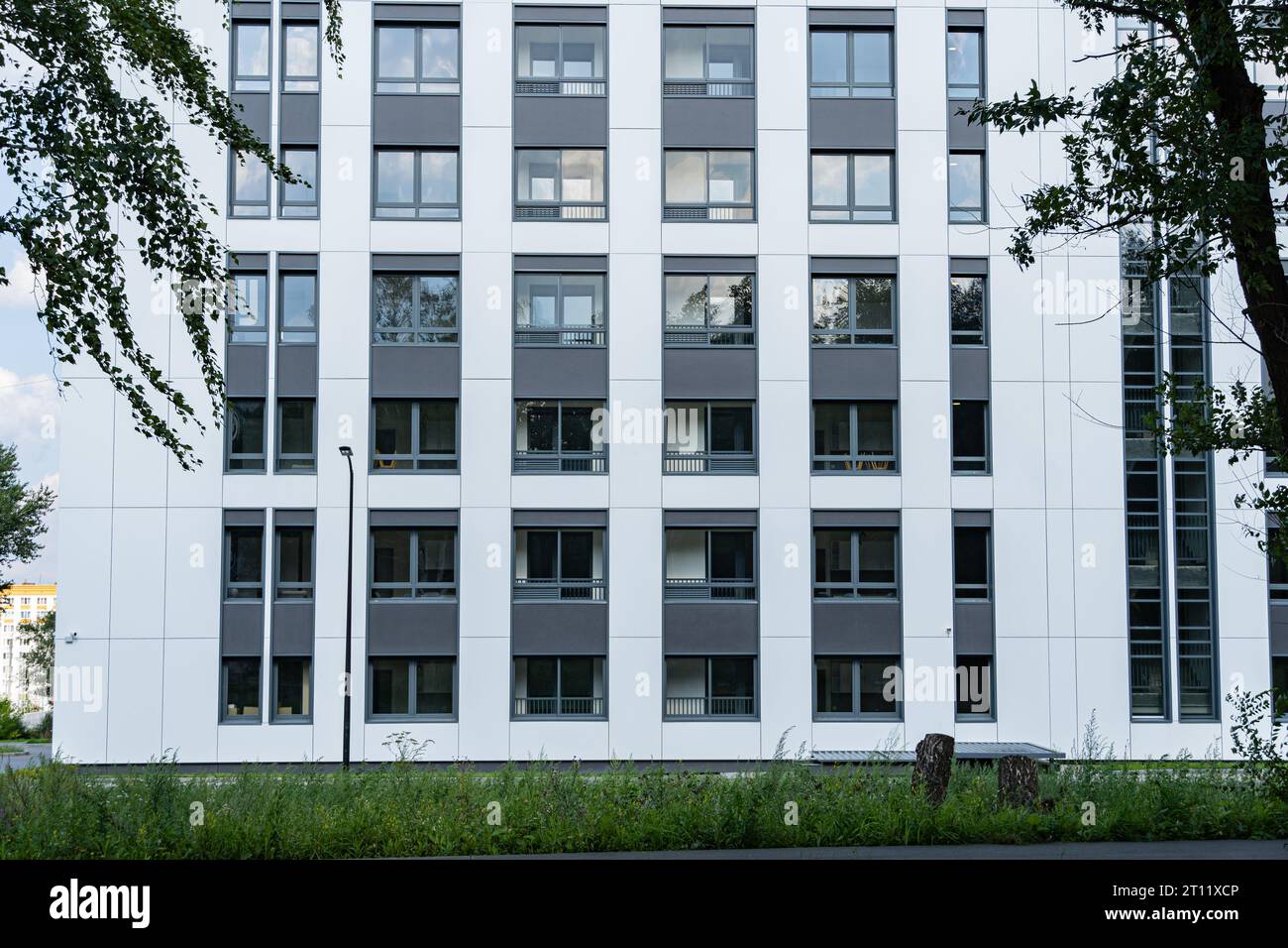 New building facade in housing complex. Modern style in architecture ...