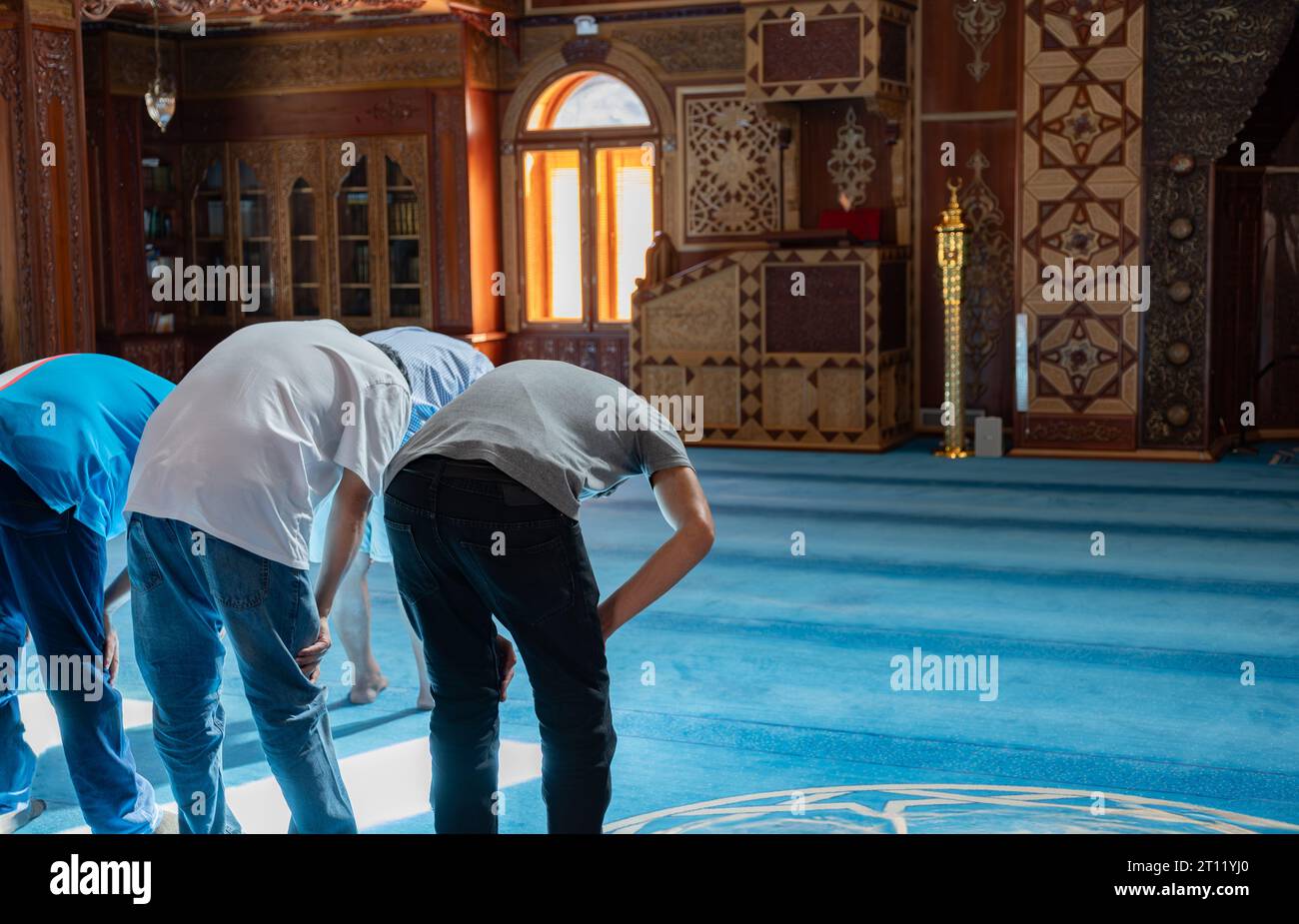 Group of people praying in mosque together with beautiful decorations ...