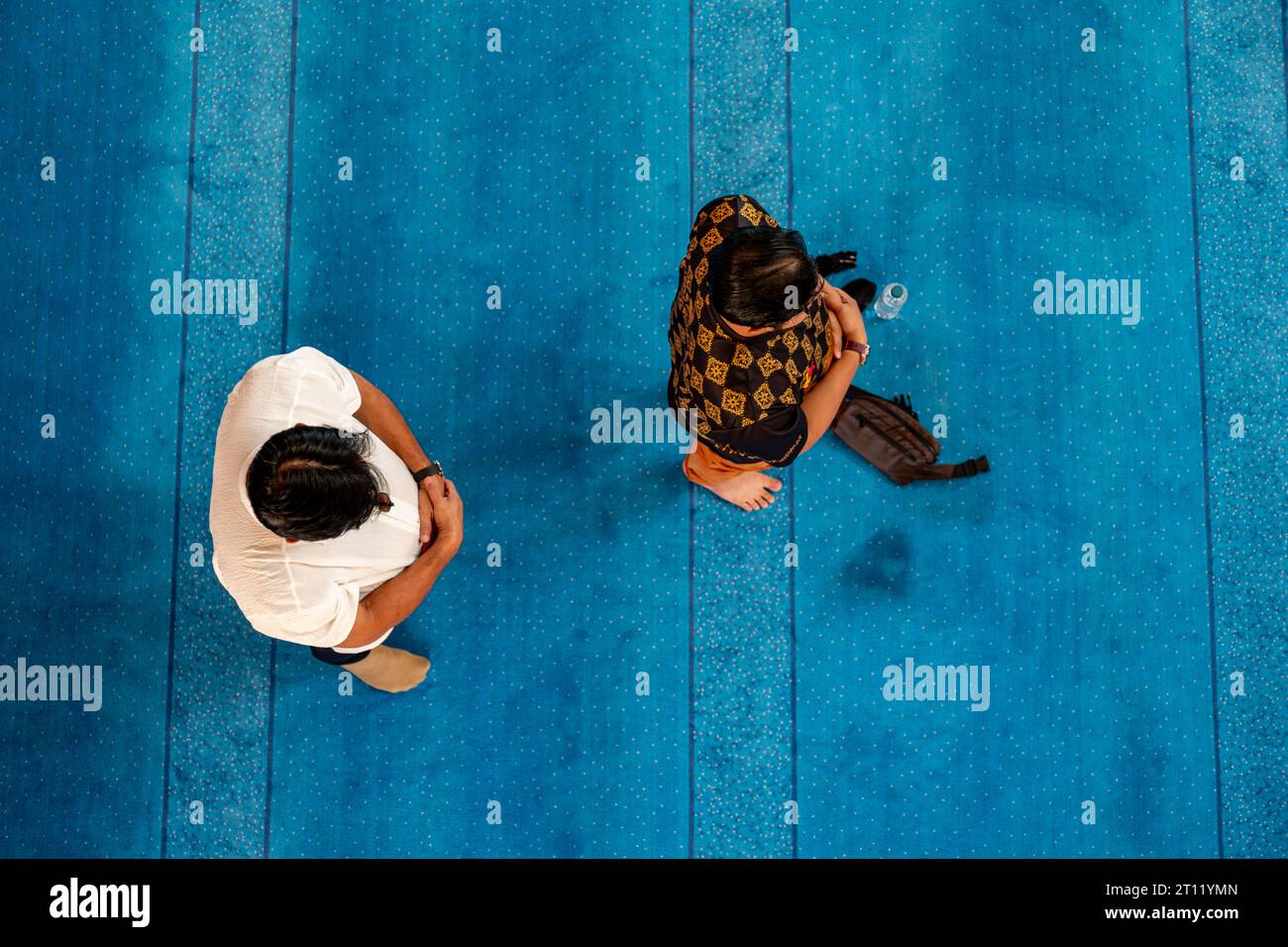 Top view for adult praying in masjid with standing position in pray ...
