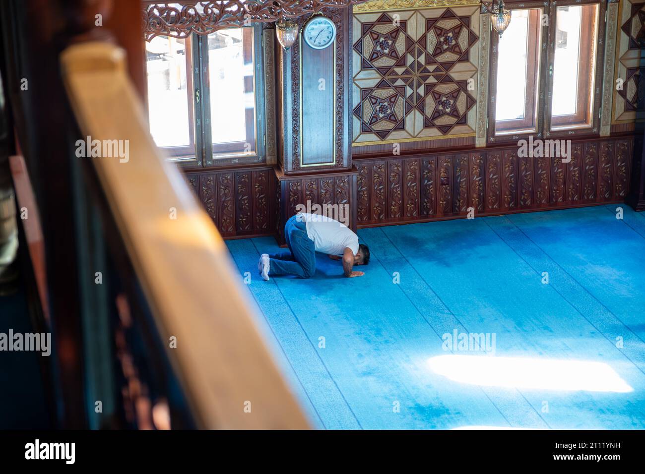 Top view of adults praying inside masjid and Prostration in prayer ...
