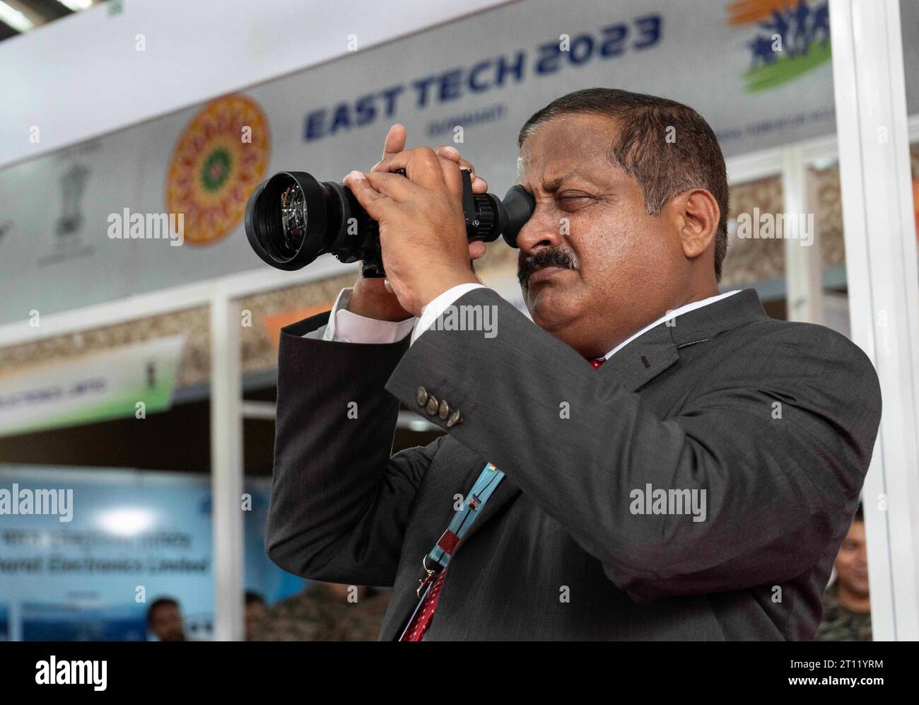 A person looks through a night vision equipment at a stall during 'East ...