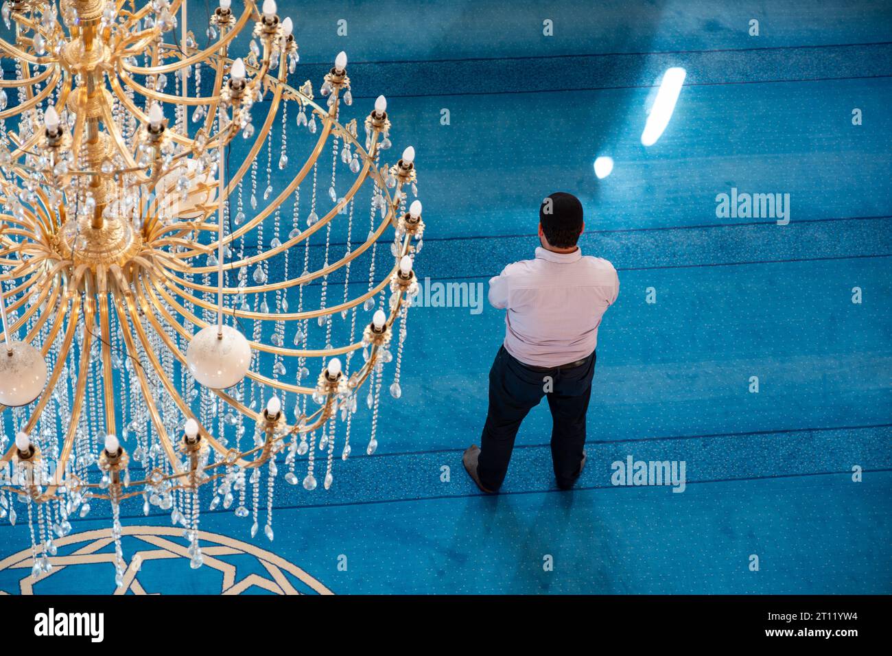 Top view for adult praying in masjid with standing position in pray ...