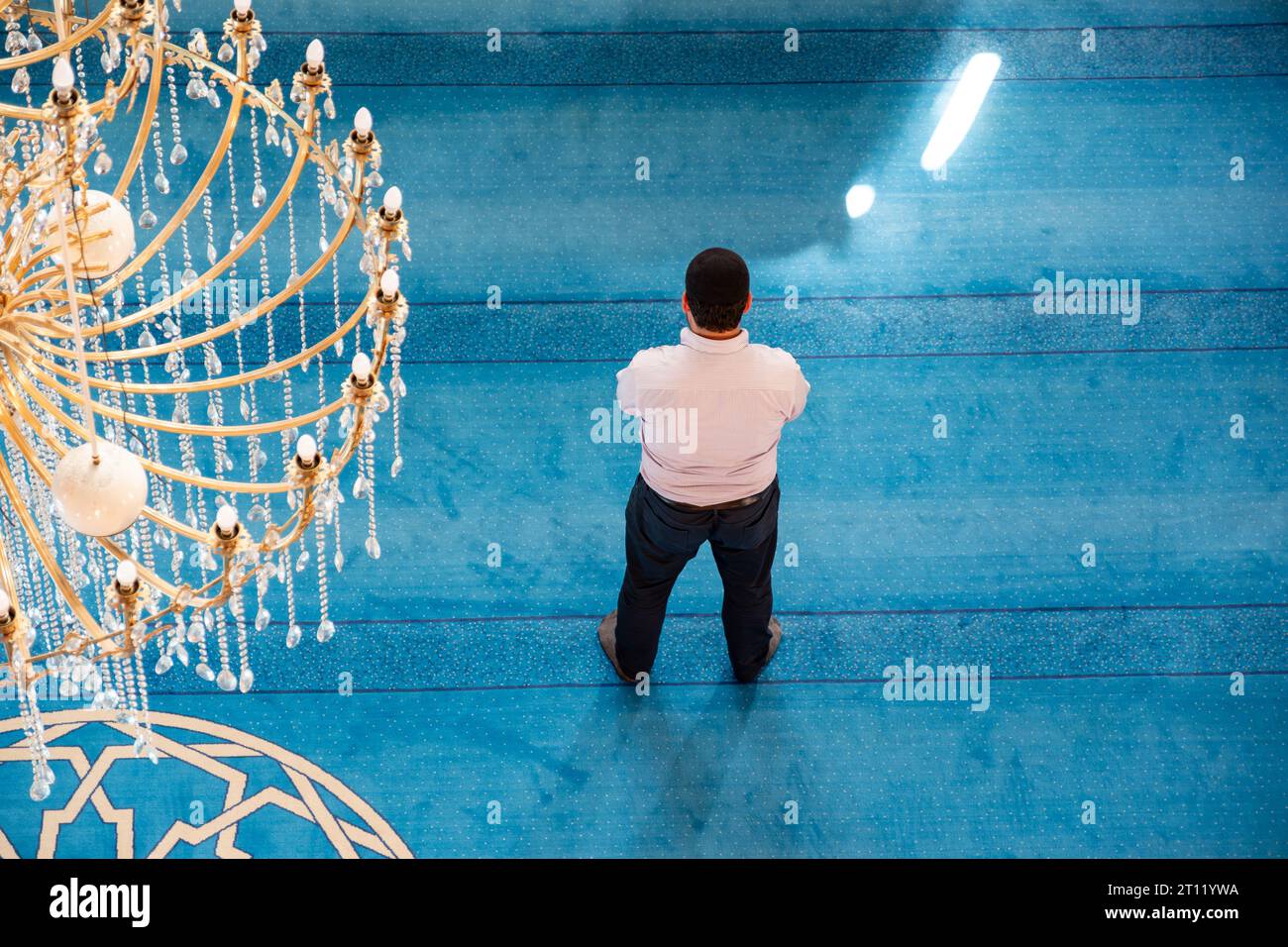 Top view for adult praying in masjid with standing position in pray ...