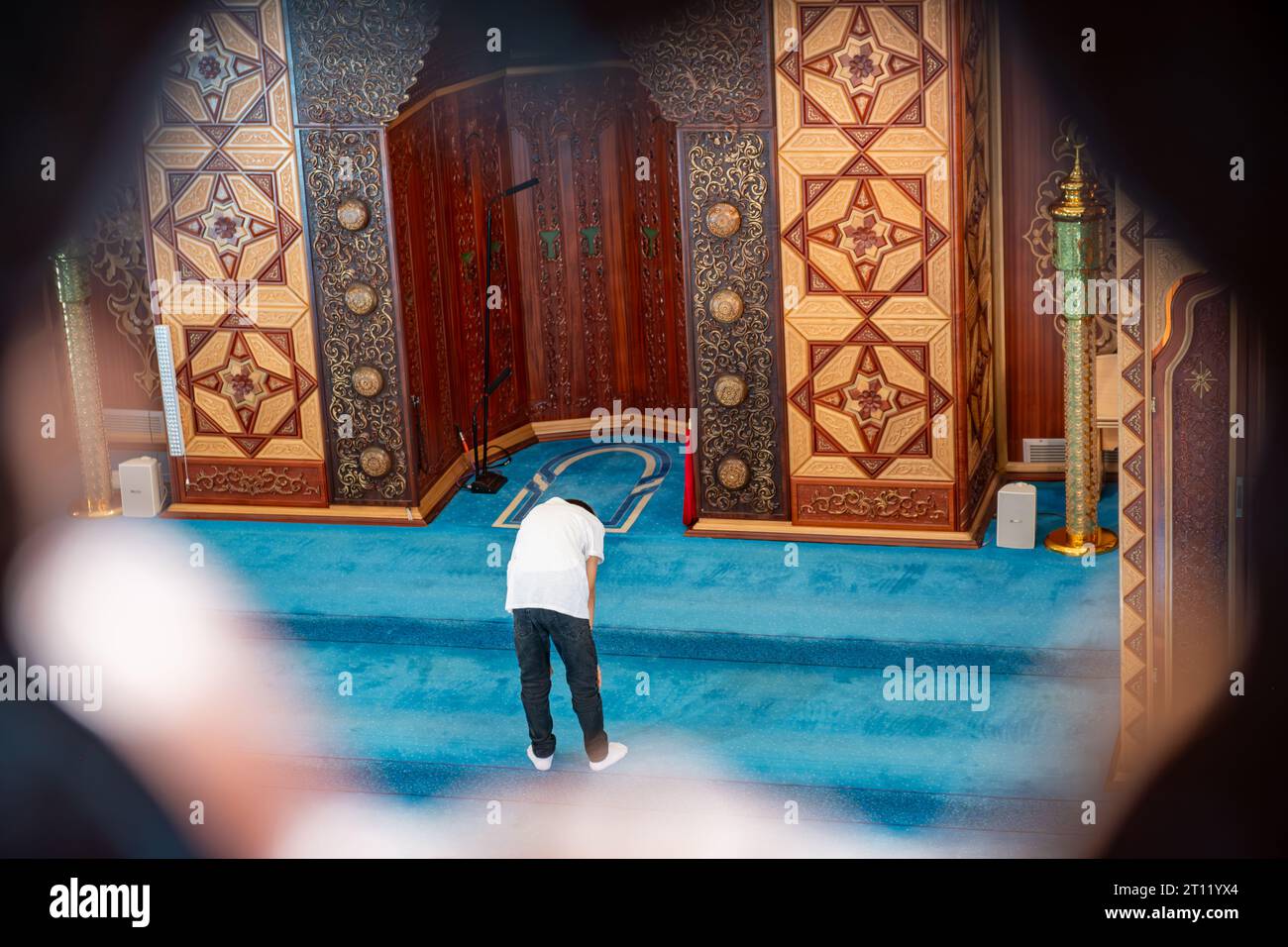 Child is praying inside mosque behind of imam place Stock Photo - Alamy