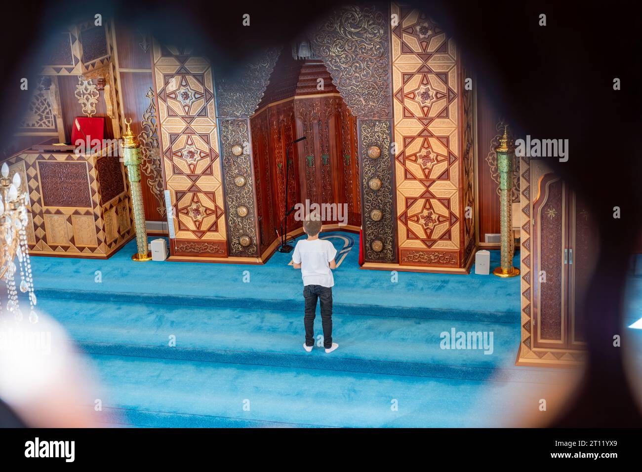Child is praying inside mosque behind of imam place Stock Photo - Alamy
