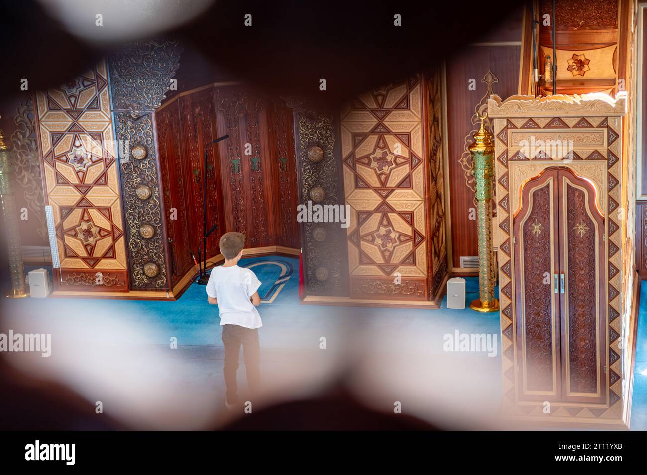 Child is praying inside mosque behind of imam place Stock Photo - Alamy