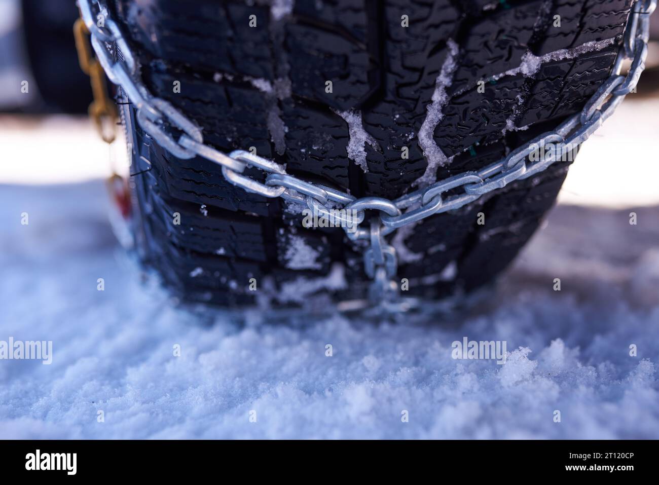 snow chain on a wheel in deep snow in winter road Stock Photo - Alamy