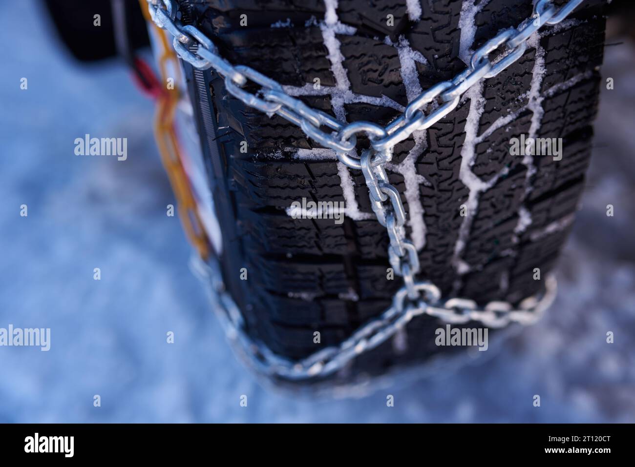snow chain on a wheel in deep snow in winter road Stock Photo - Alamy