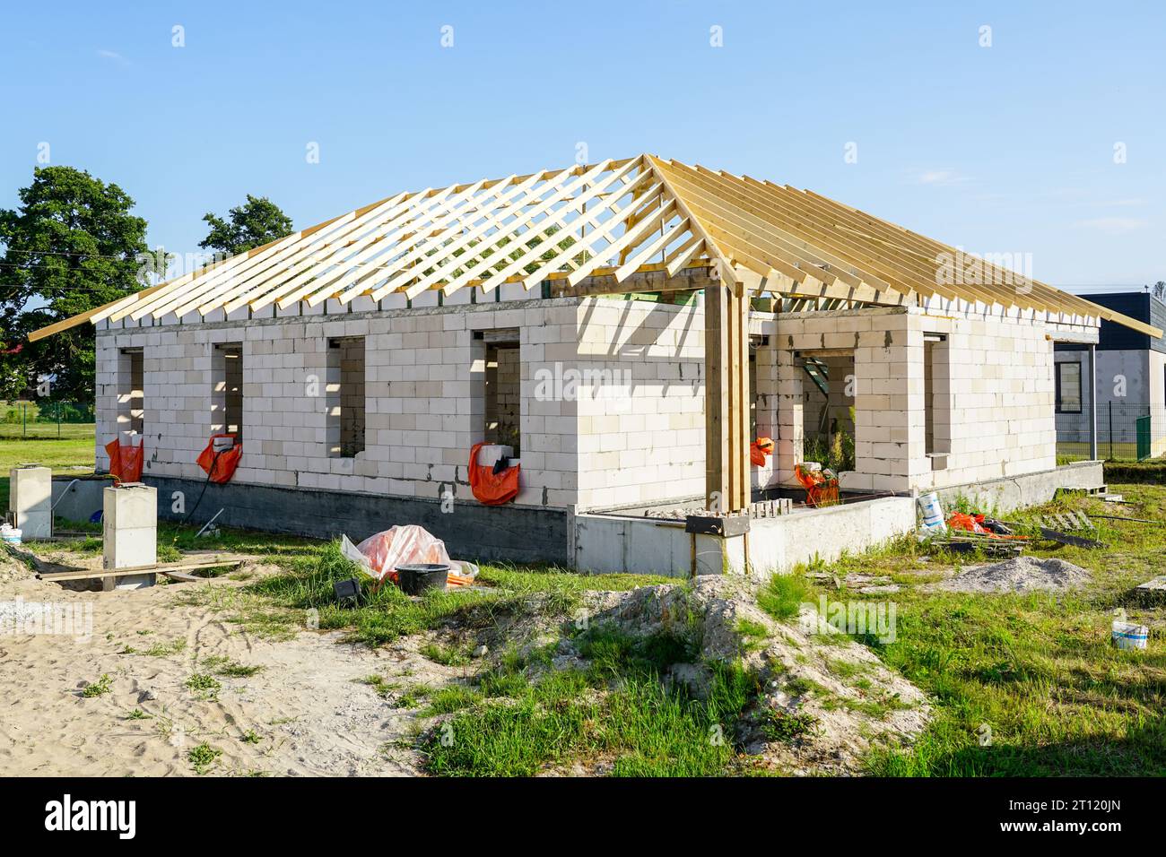 Unfinished residential house with white concrete block walls and a ...