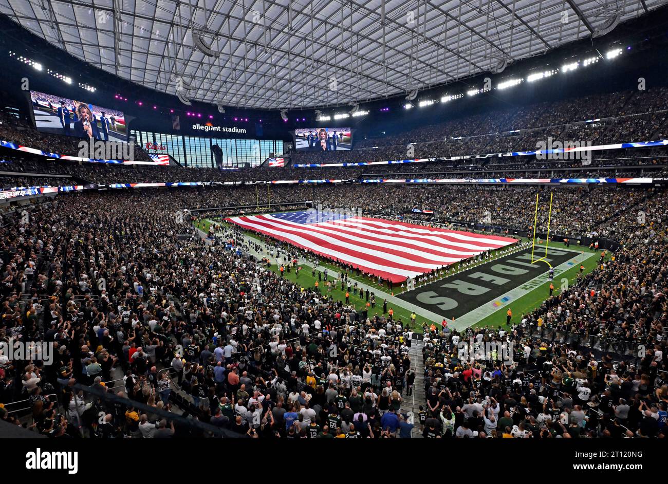 Fans stand during the singing of the American national anthem at ...
