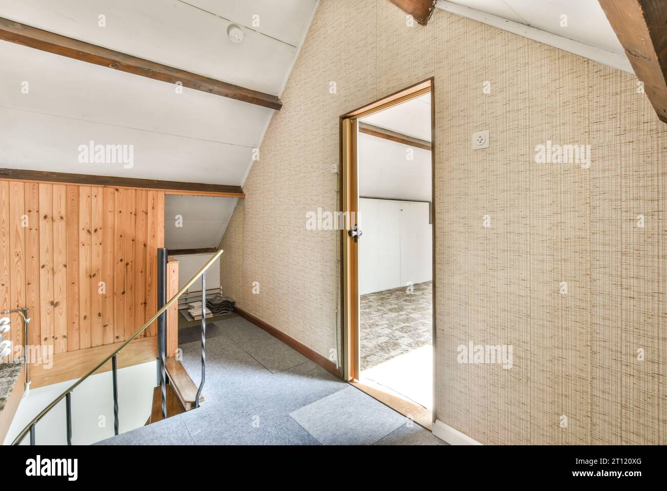 the inside of a house with wood paneling on the walls, and an open door ...