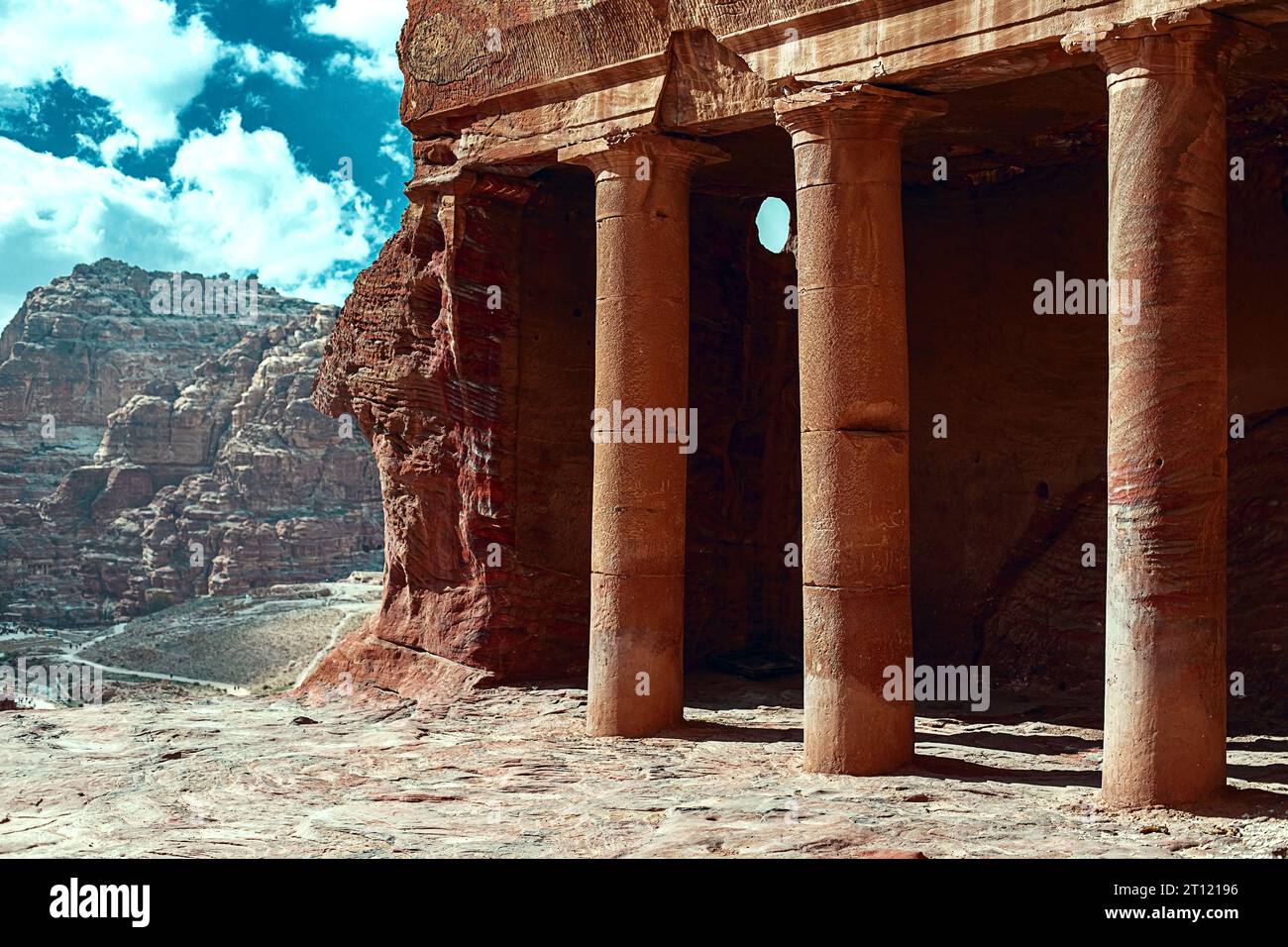 View of the Temples carved into the sandstone rock in the gorge. Petra ...