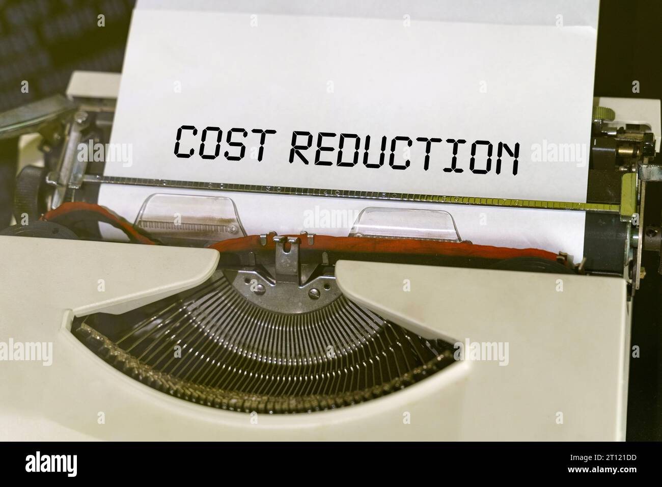 Economy and finance concept. The text is printed on a typewriter - cost ...