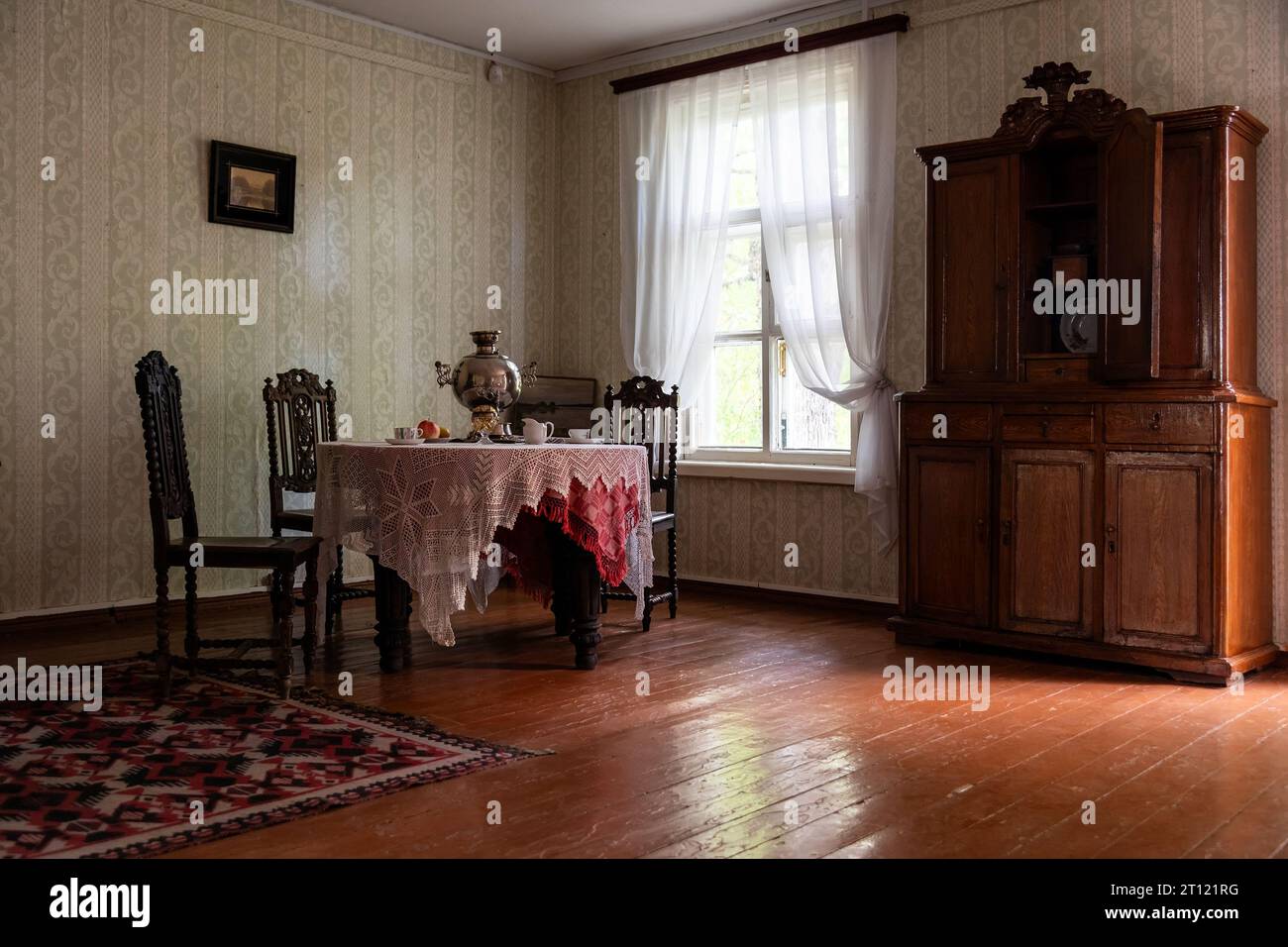 Original interior of a dining room in a rural house with a buffet, a ...