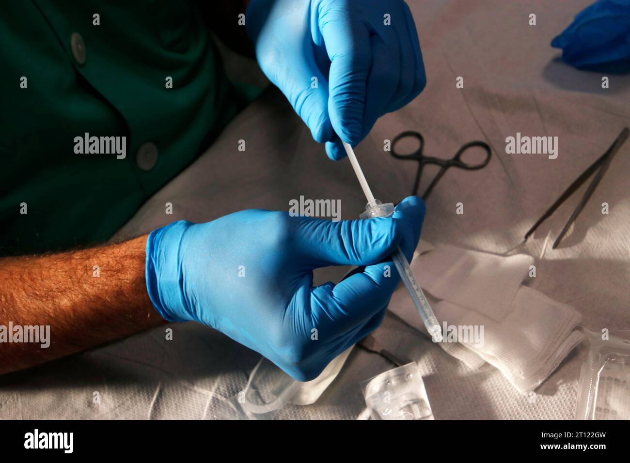 A medical professional preparing a syringe Stock Photo - Alamy