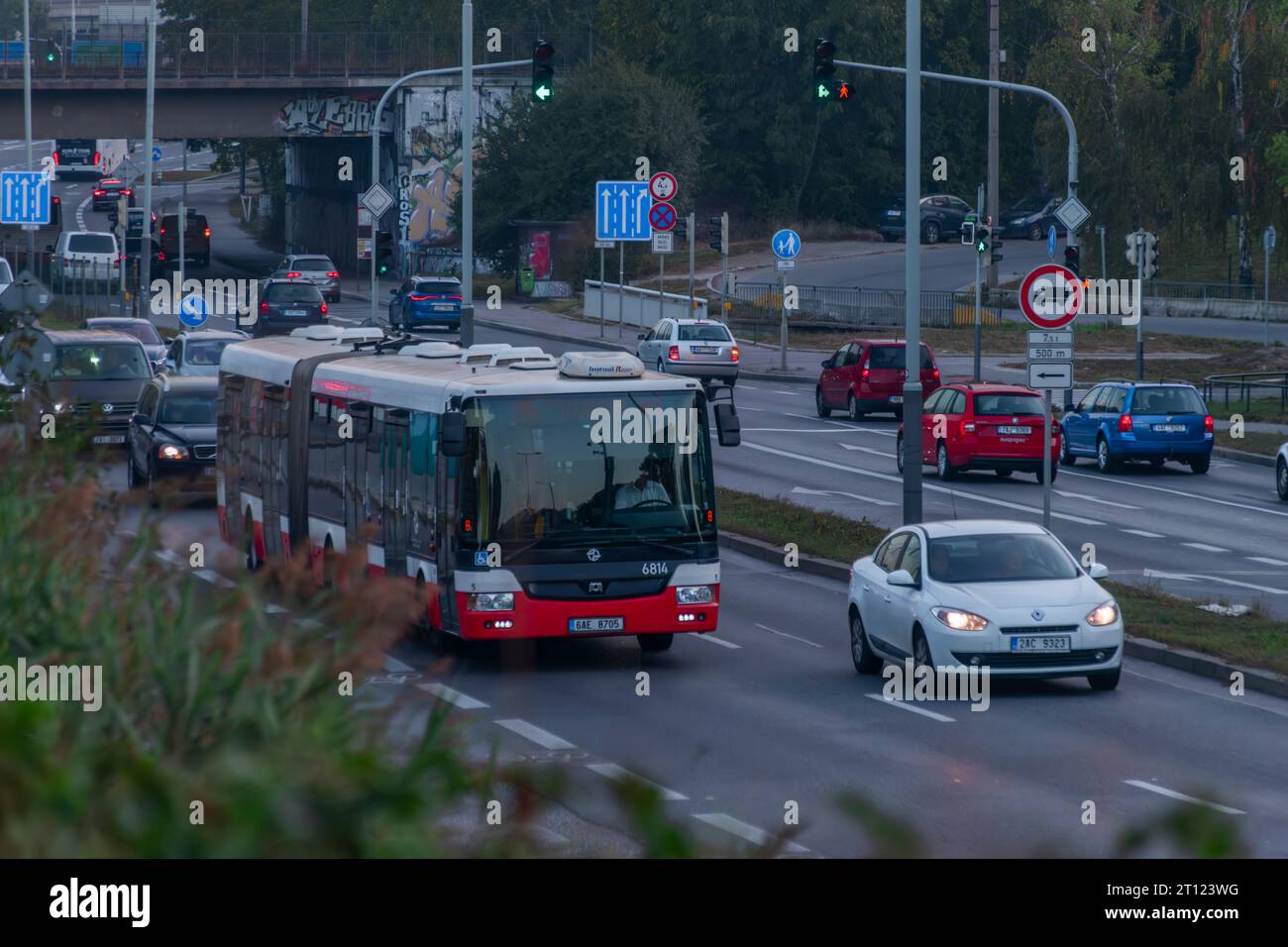 Public transport red bus in capital in sunrise color morning in Prague ...