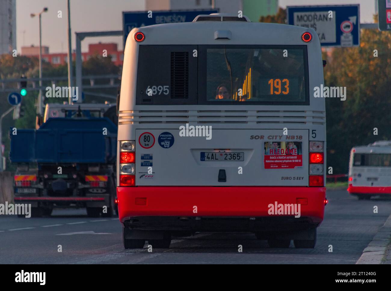 Public transport red bus in capital in sunrise color morning in Prague ...