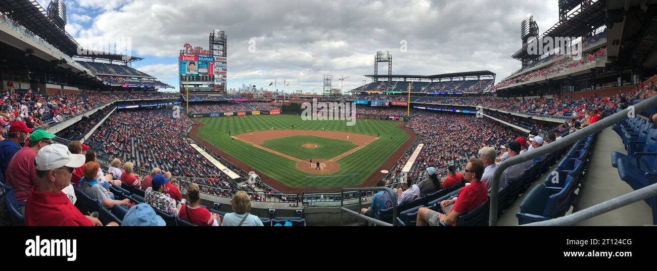 A panoramic view of people sitting at a stadium during a baseball match ...