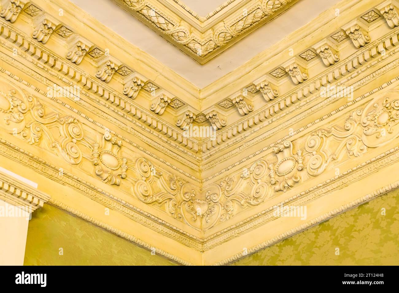 Decoration pieces between an interior wall and the ceiling of the room ...