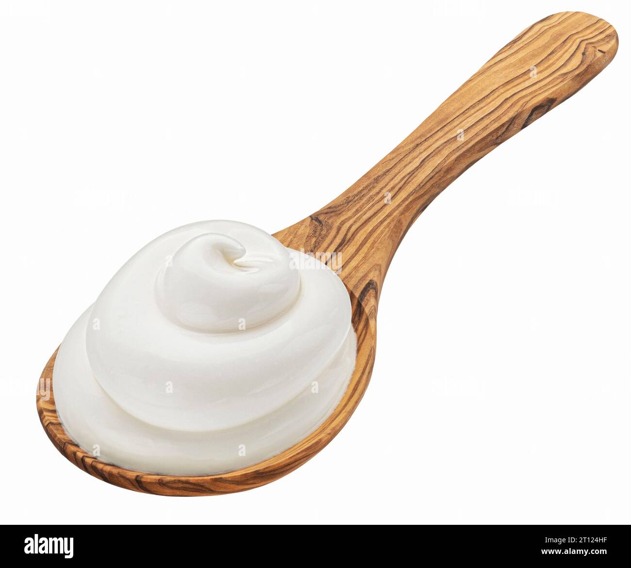 Sour cream in wooden spoon isolated on white background Stock Photo - Alamy