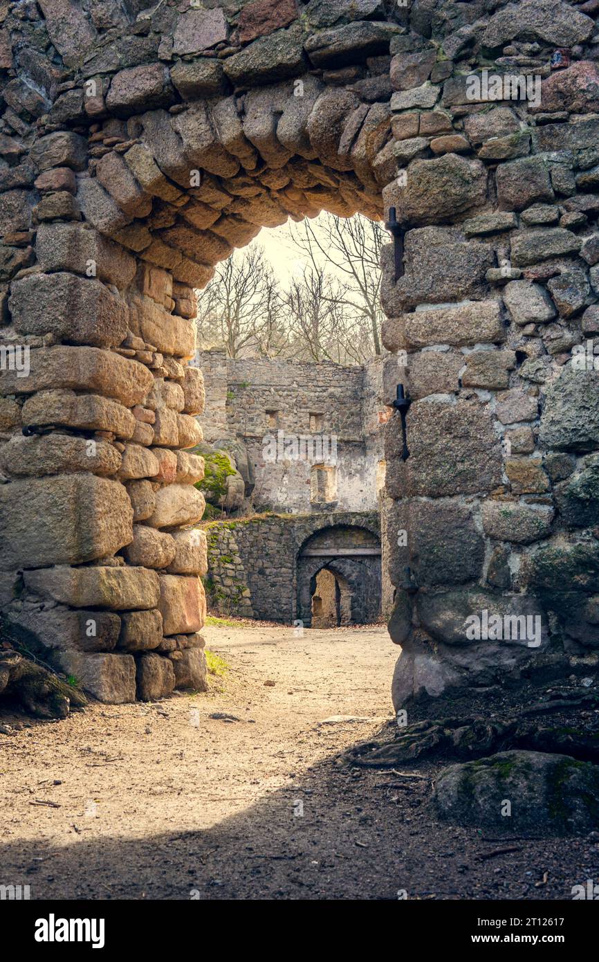 a passage through a wall in an old castle ruins Stock Photo - Alamy