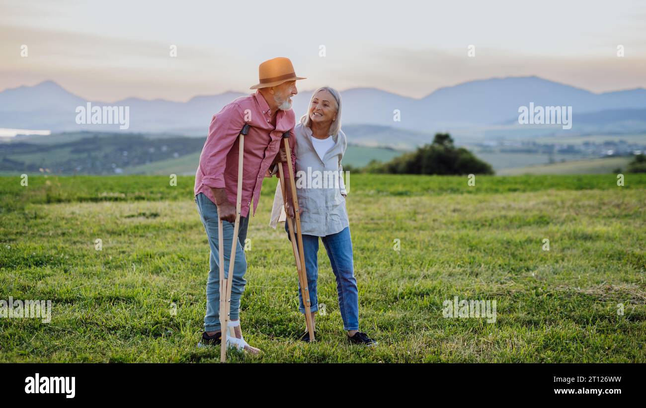 Senior man with broken leg and crutches. Recovery, rehabilitation after ...