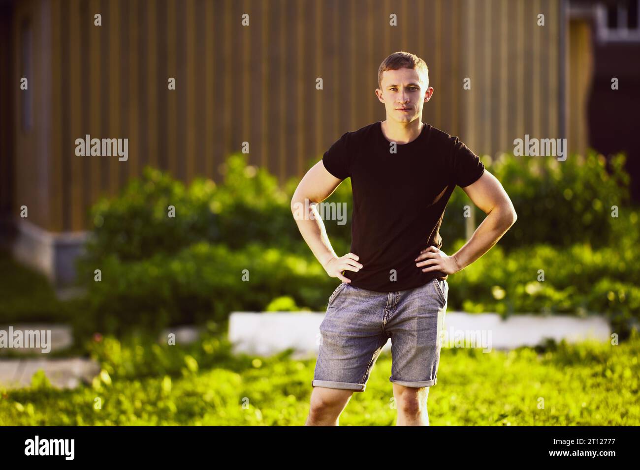 European man 26 years old standing knee-length street portrait Stock ...