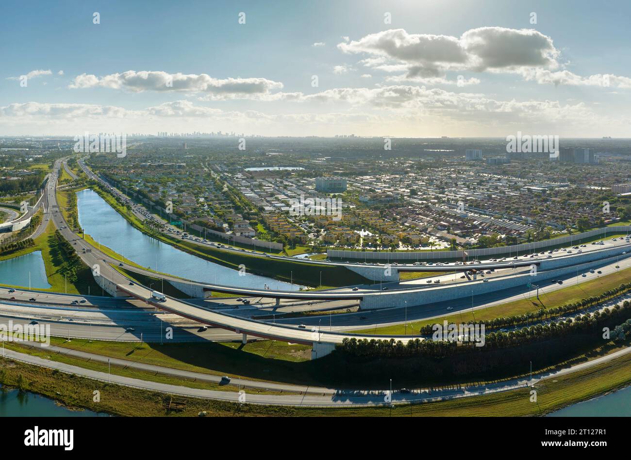 Aerial view of american highway junction with fast driving vehicles in ...
