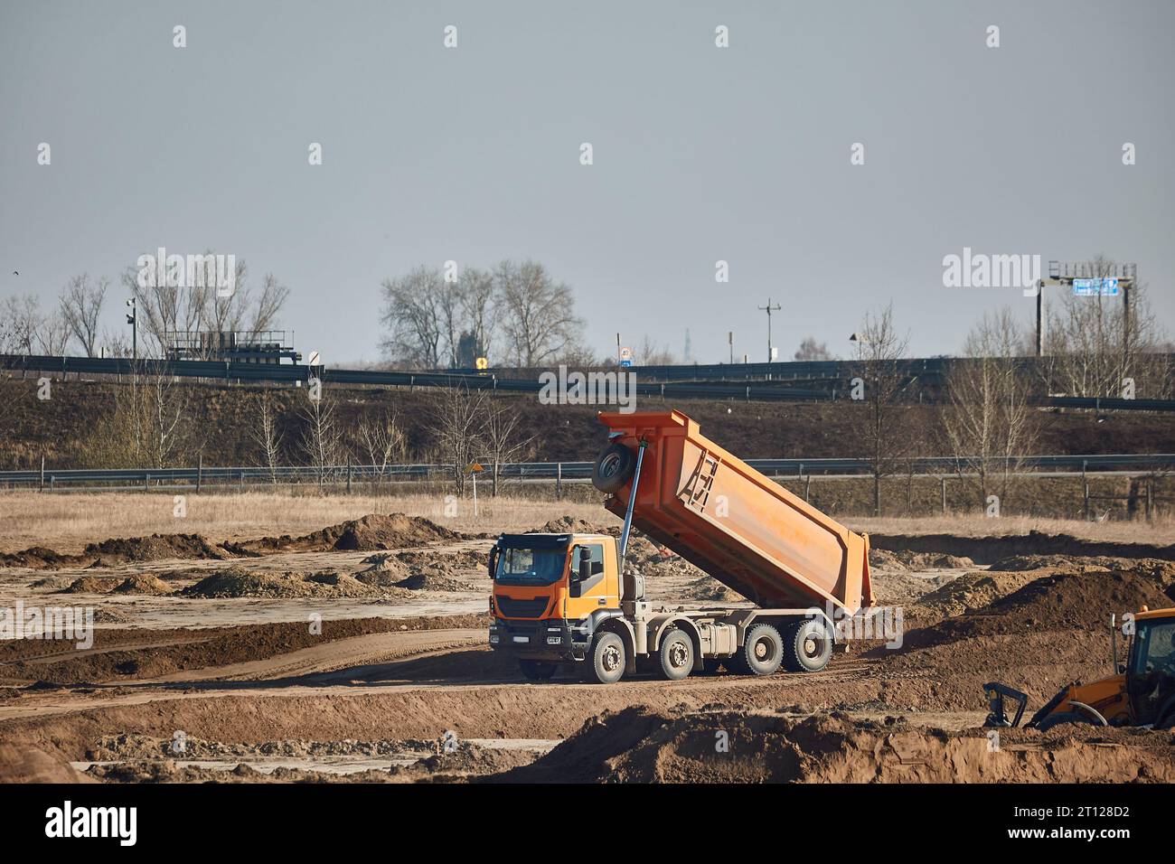Road construction truck hauling gravel Stock Photo - Alamy